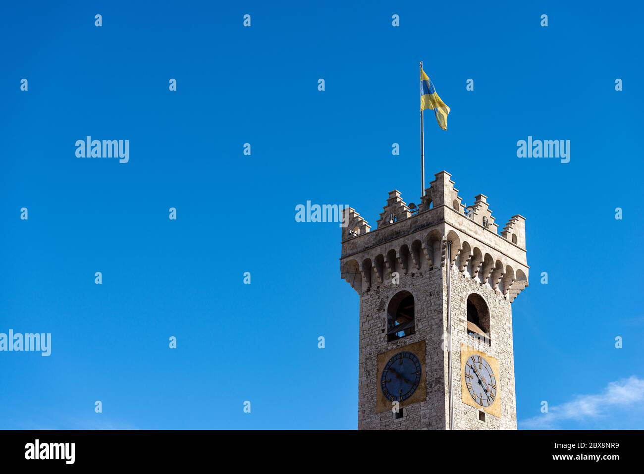 Torre Civica, Medieval civic clock tower with the city flag in Piazza ...