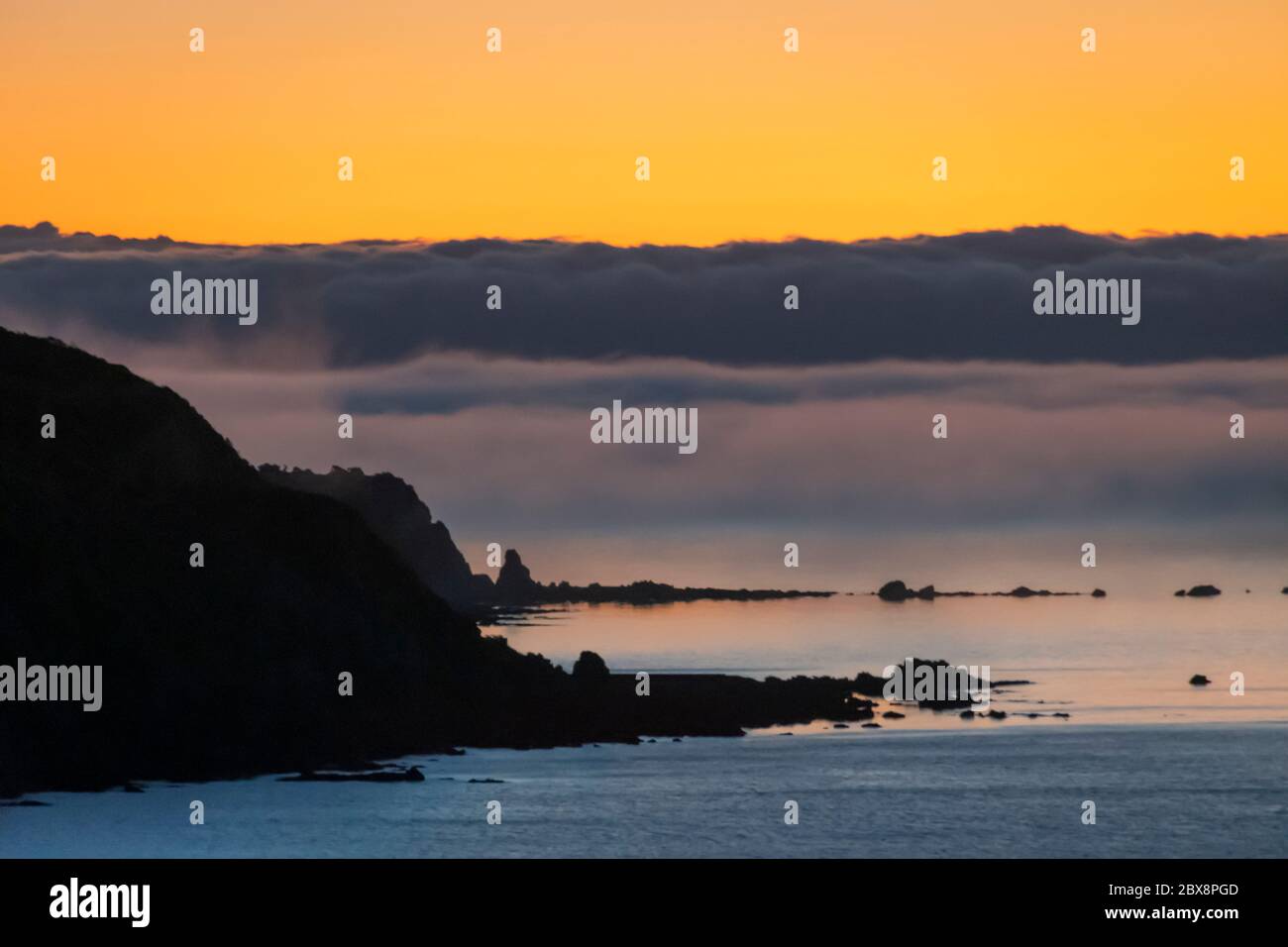 Sunset over misty bay hi-res stock photography and images - Alamy