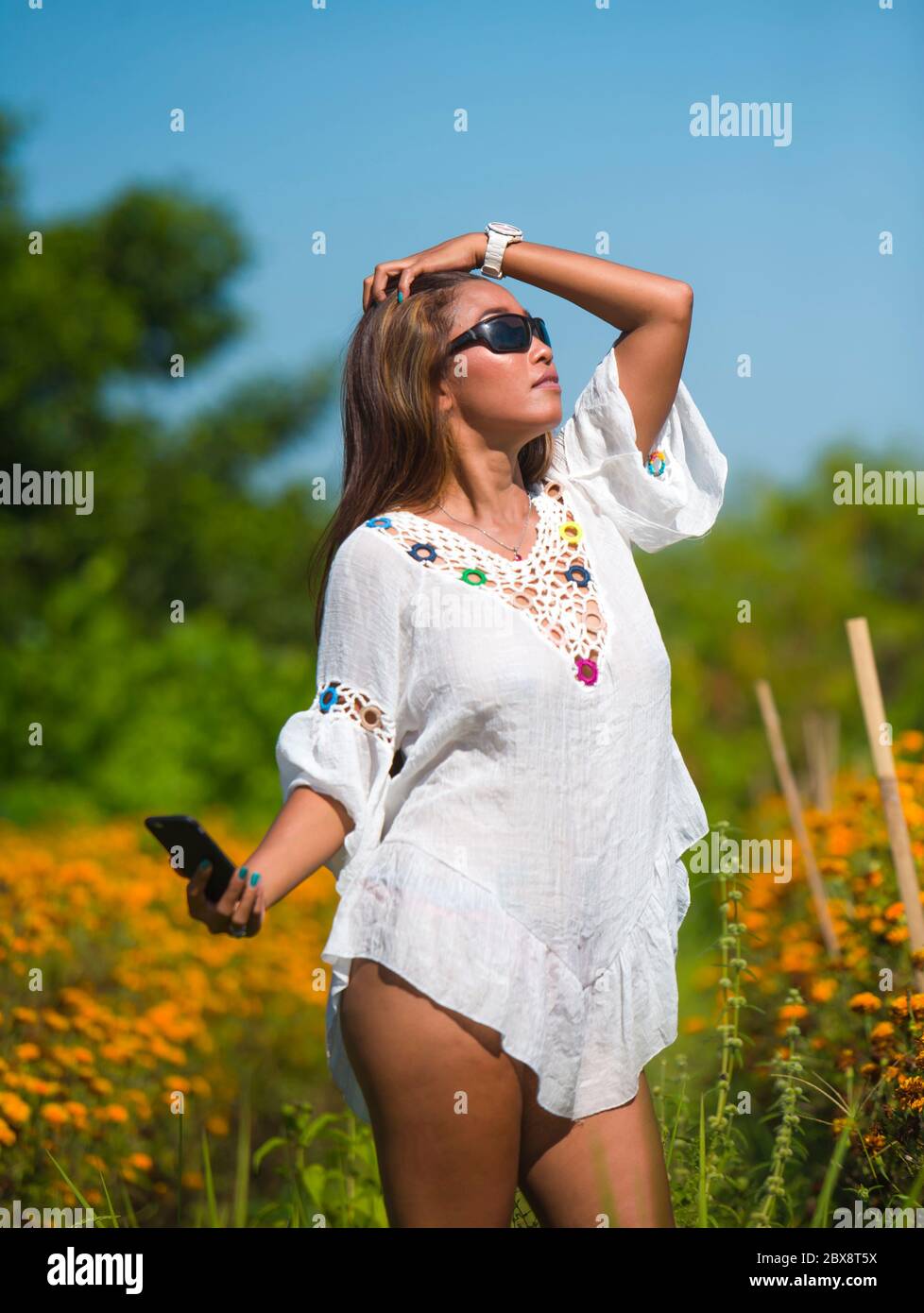 happy and beautiful young Asian tourist woman taking selfie pic in ...