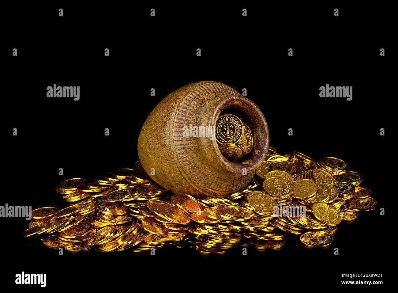 Gold coin in treasure old pot on black background Stock Photo - Alamy
