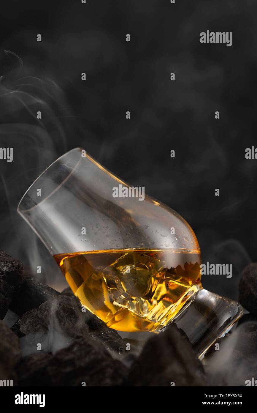 A Glencairn Whisky Glass Sitting On Coal Stock Photo - Alamy