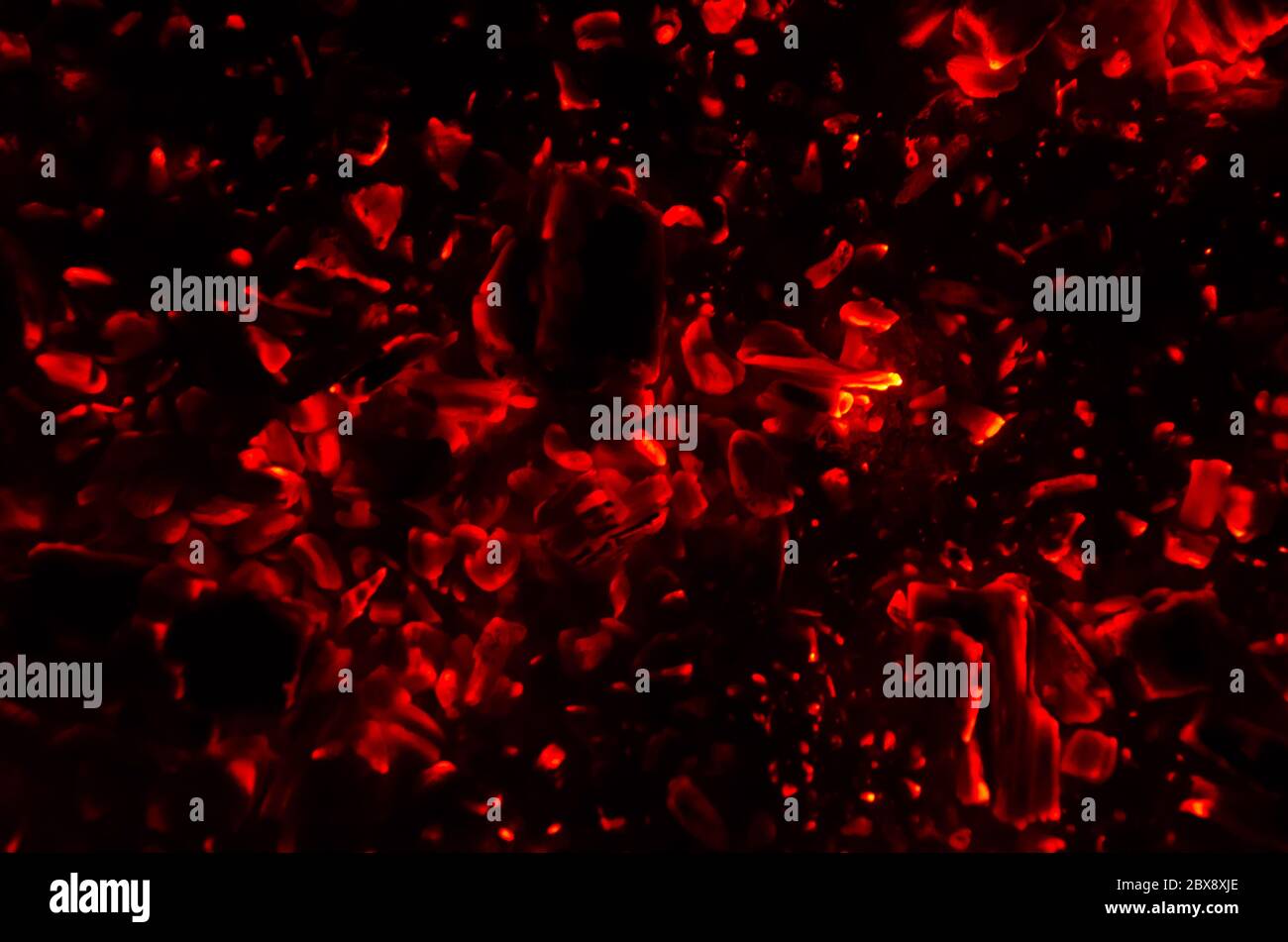 Actively smoldering embers of fire. Background of burning hot coals ...