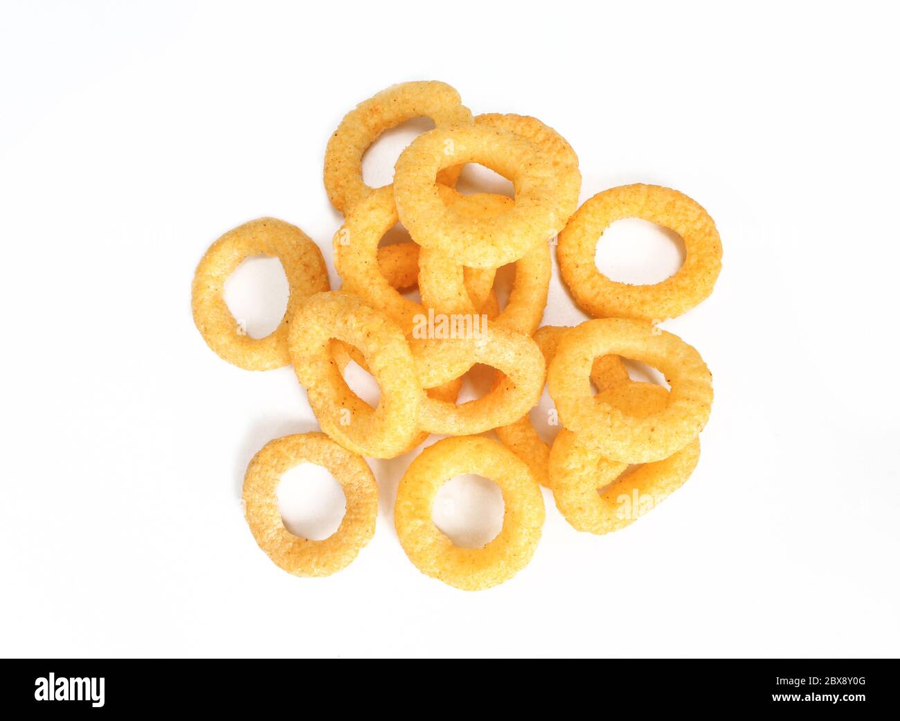 Delicious ring snacks isolated on white background. Pile of yellow ...