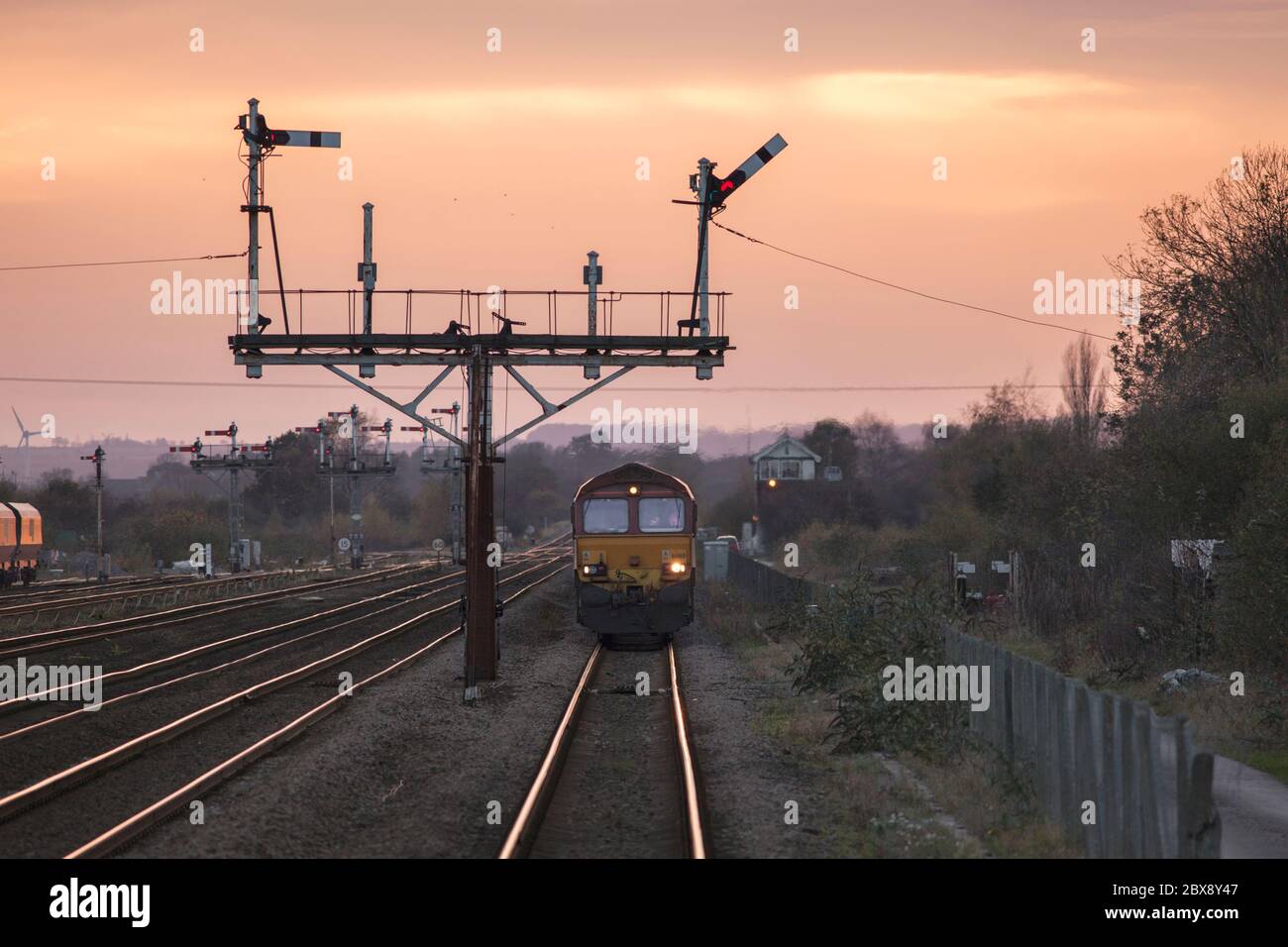 DB cargo UK class 66 locomotive 66160 approaching the bracket semaphore ...