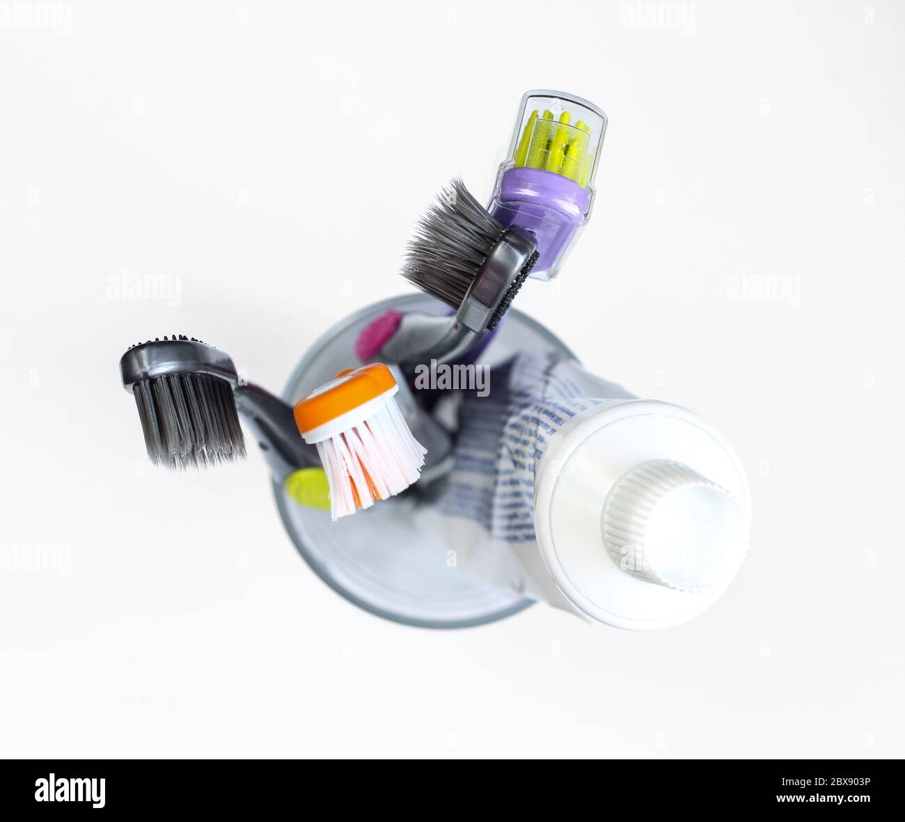 Toothpaste and toothbrushes in glass isolated. Dental hygiene set of ...