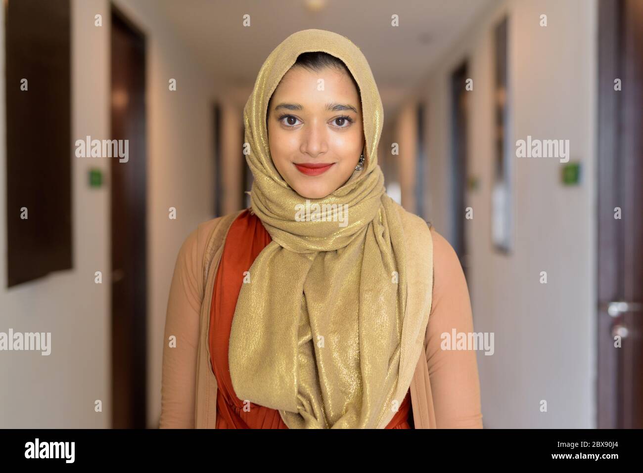 Young beautiful Indian Muslim woman wearing hijab in the corridor Stock ...