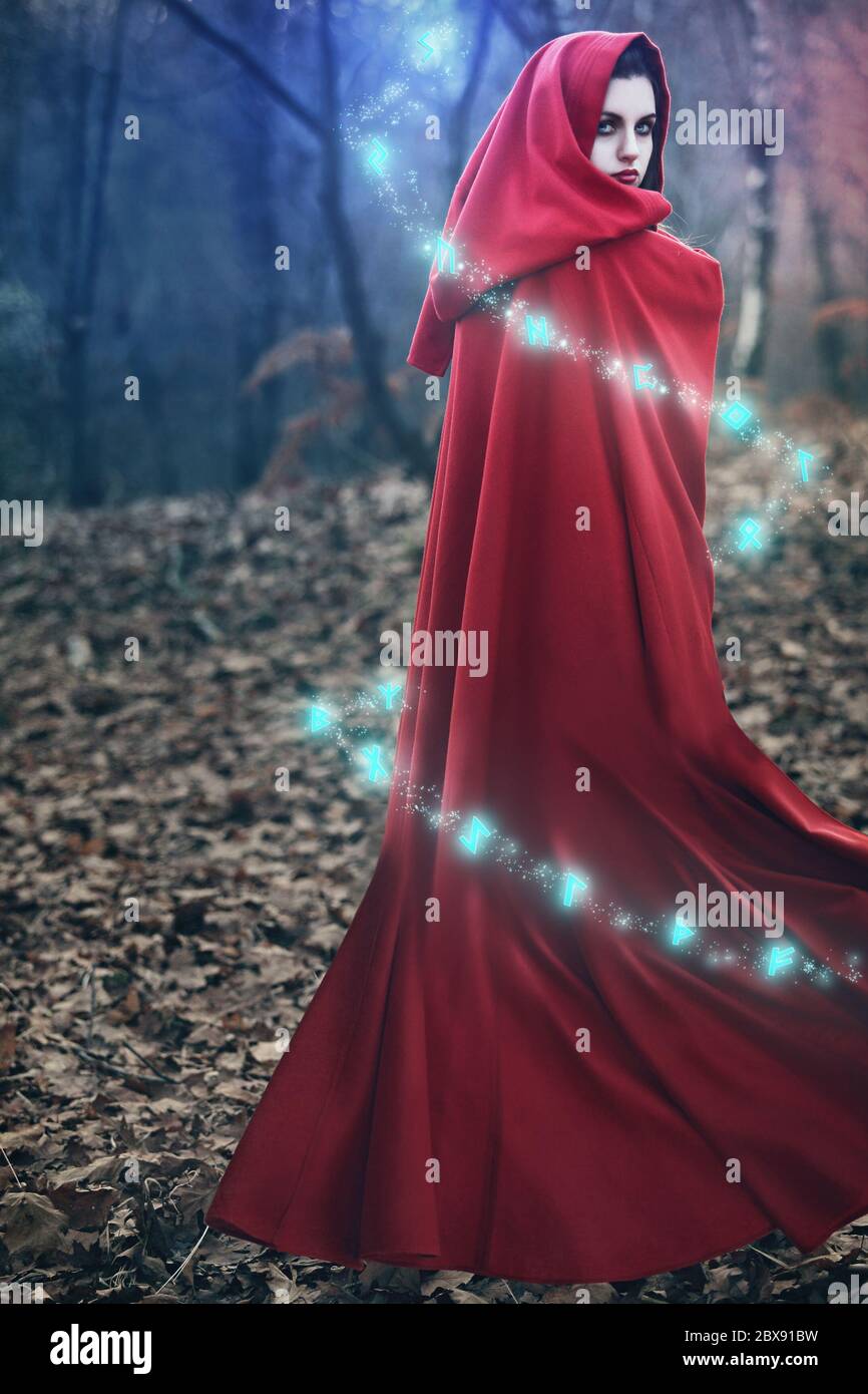 Fantasy beautiful woman with red flying cloak and swirling runes around ...