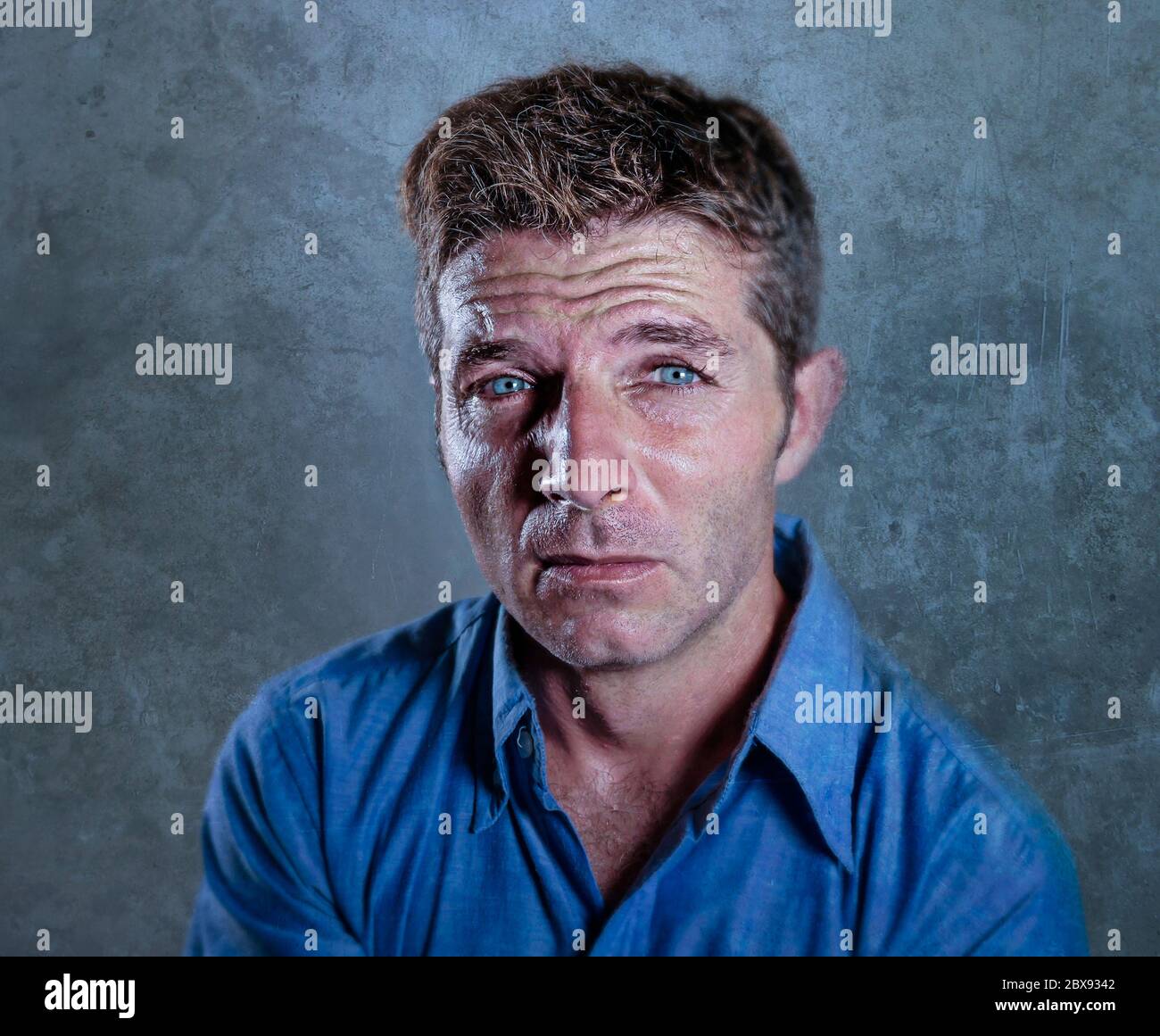 close up portrait of young attractive man sad and depressed suffering ...