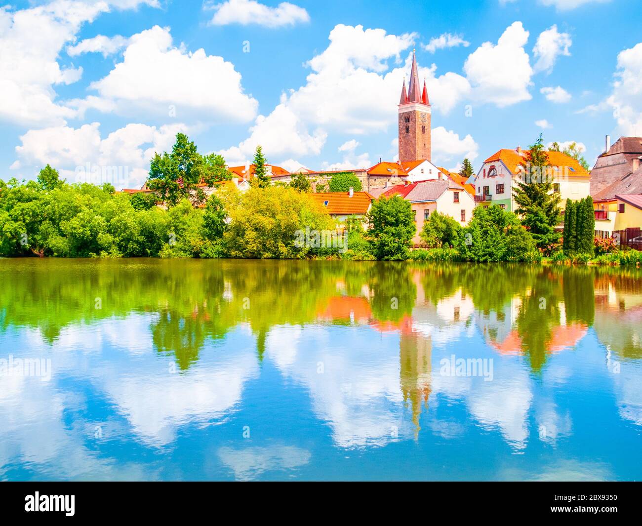 Tower of Church of the Holy Spirit in Telc on sunny summer day ...