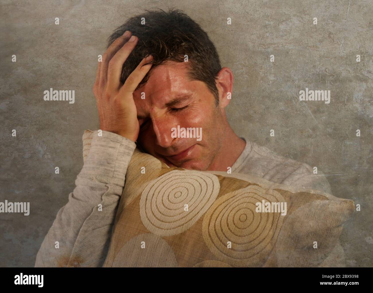 young sad and desperate Caucasian man crying feeling lost and suffering ...