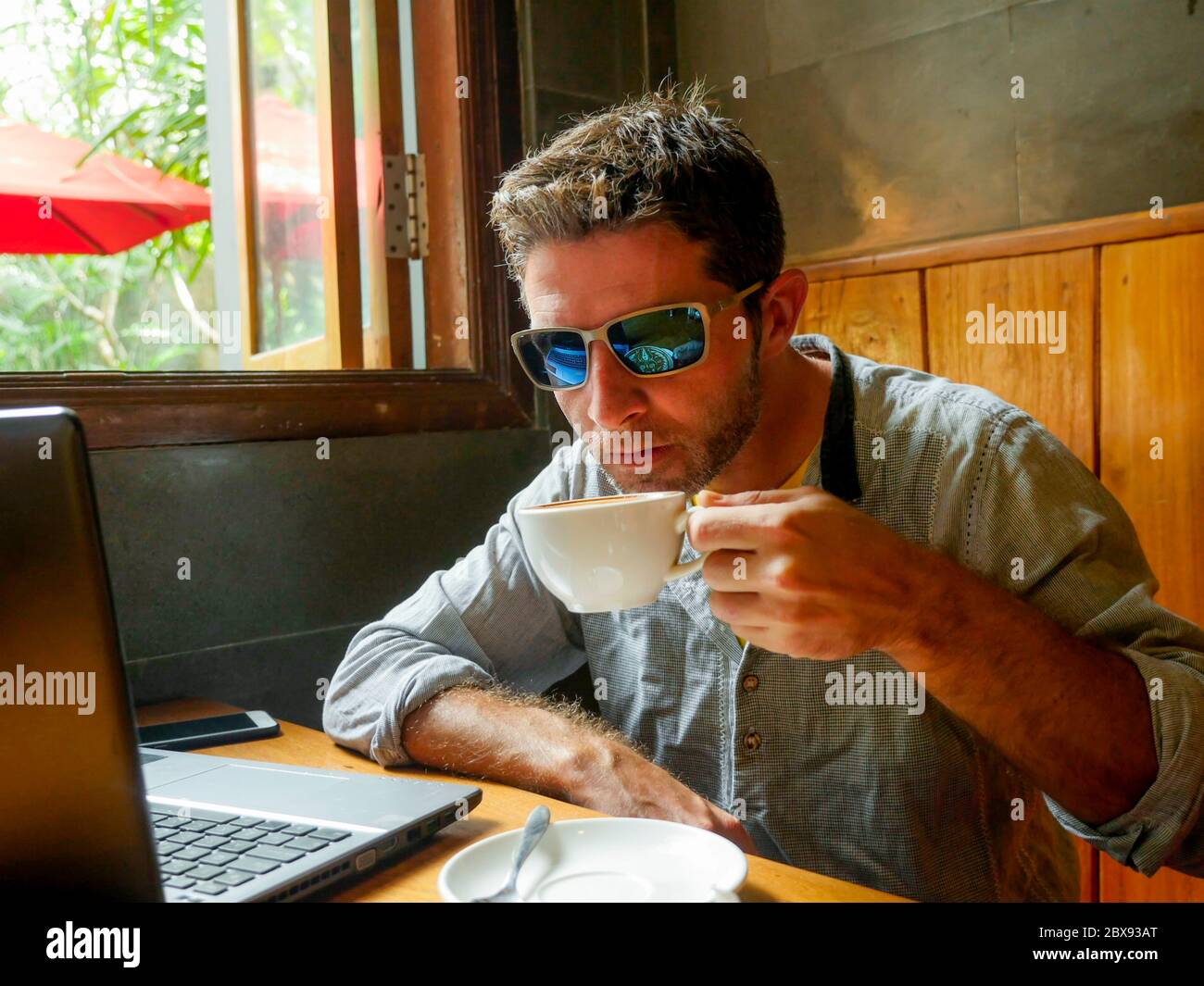 young attractive happy and successful millennial man working from ...