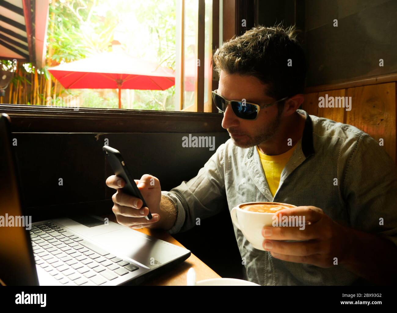 young attractive happy and successful millennial man working from ...