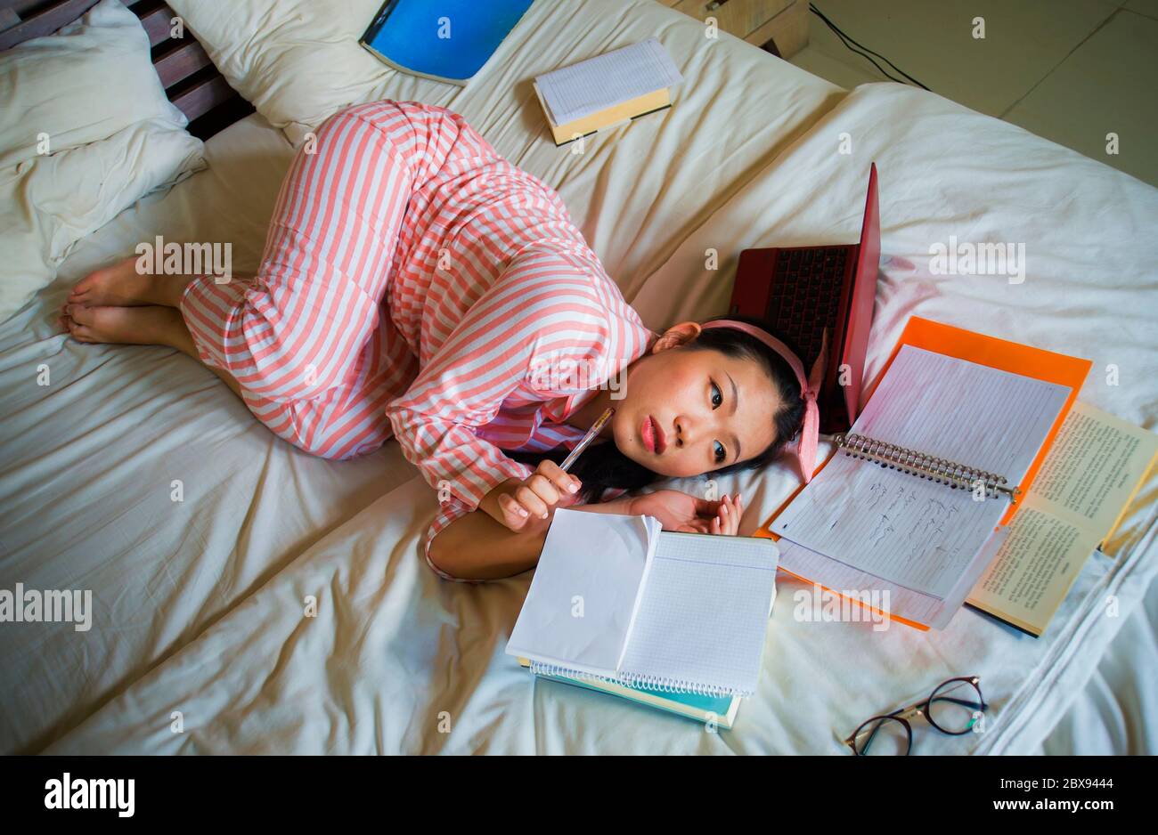 young desperate and tired Asian Korean university student girl feeling ...