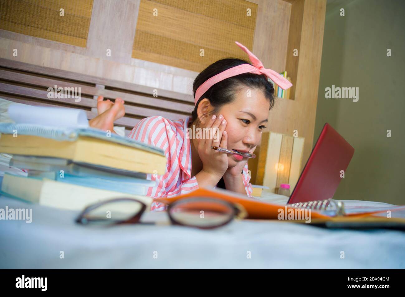 young cute and happy nerdy Asian Korean student teenager girl in nerd ...