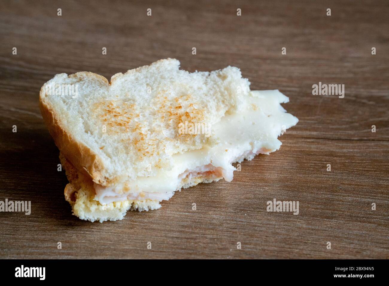 Half Eaten Sandwich thrown on the floor. Discarded Sandwich. Bread ...