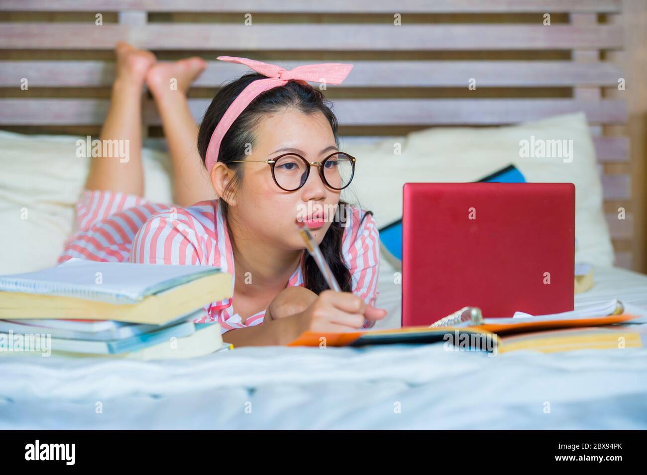 young confident and beautiful Asian Chinese student girl preparing ...