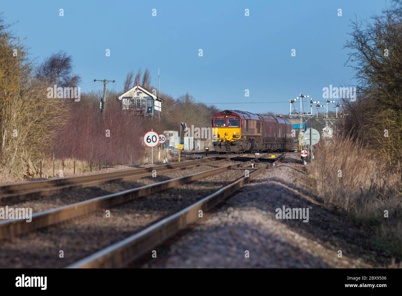 DB cargo class 66 locomotive 66014 passing the mechanical signal box at ...