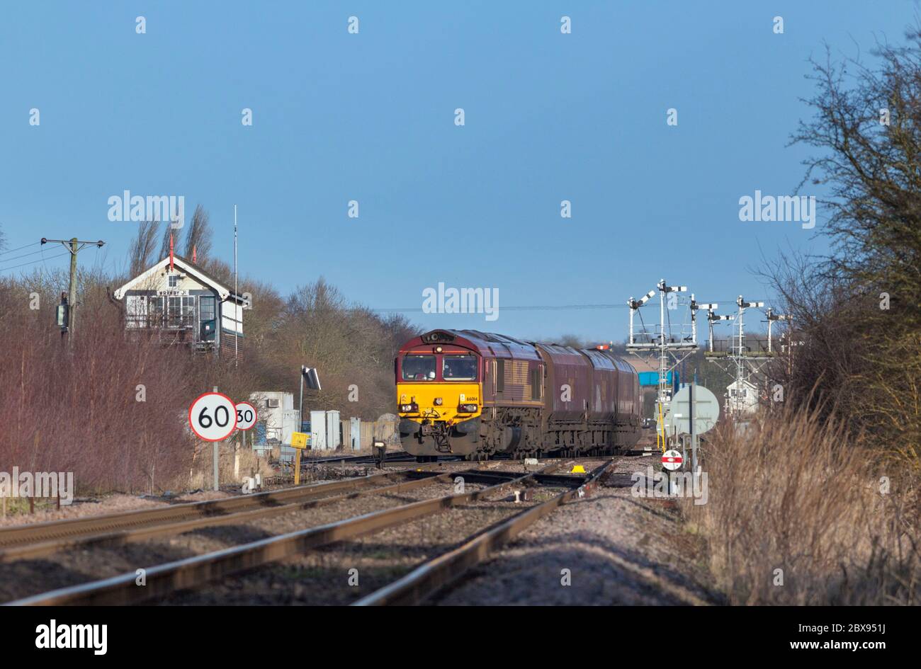 DB cargo class 66 locomotive 66014 passing the mechanical signal box at ...