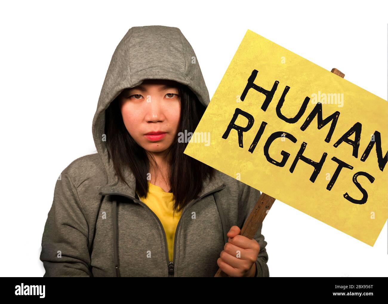 young beautiful Asian Chinese student woman as protestor and pacifist ...