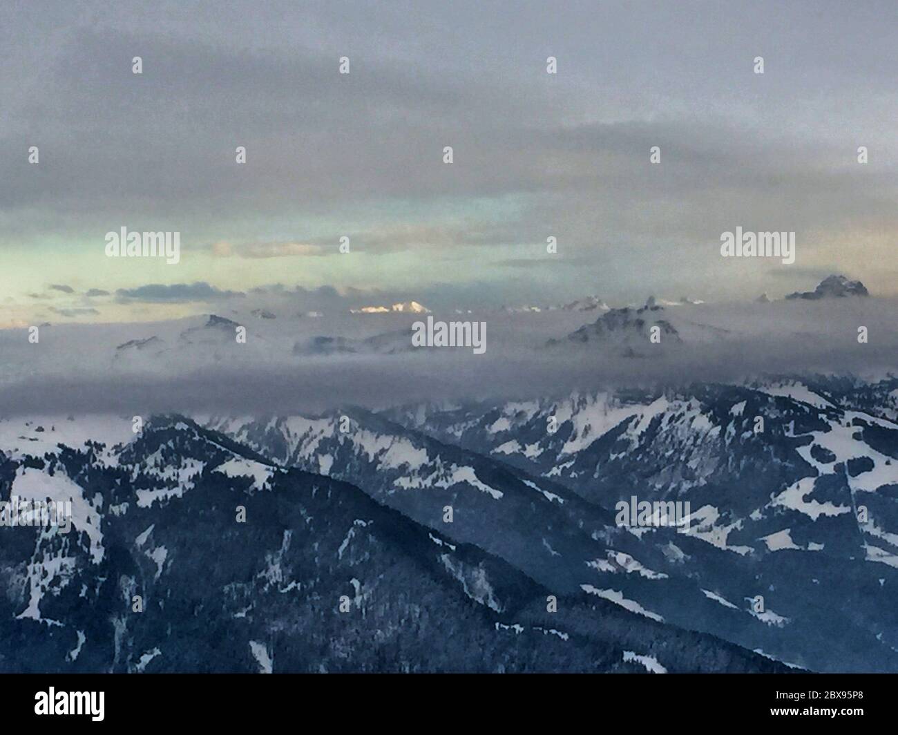 Snow covered austrian mountains Stock Photo - Alamy