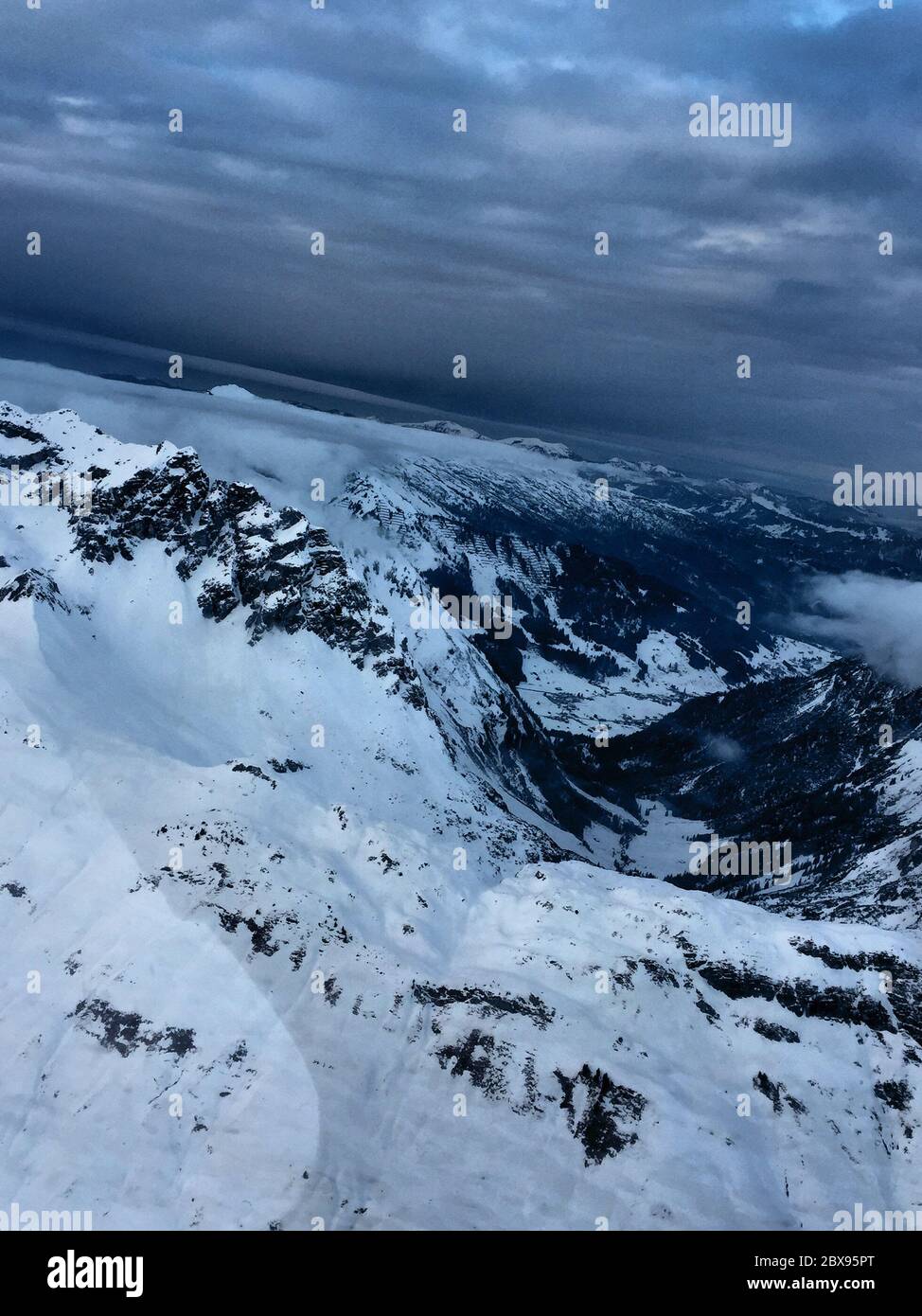 Snow covered austrian mountains Stock Photo - Alamy