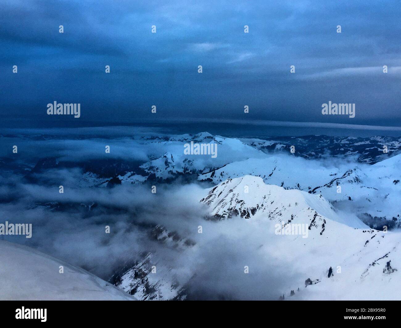 Snow covered austrian mountains Stock Photo - Alamy