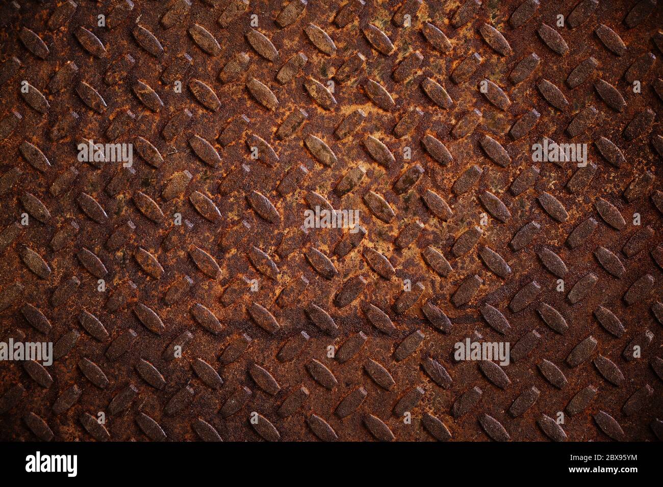 Old and rusty metal floor. Texture of a rough metal sheet with a convex ...