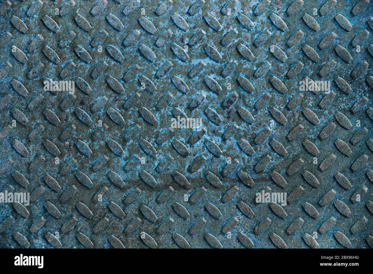 Old and rusty metal floor is blue. The texture of a rough metal sheet ...