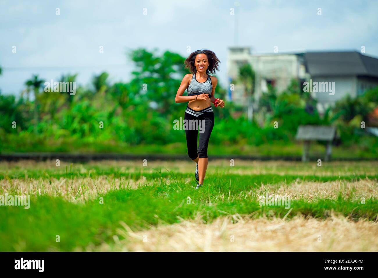 healthy lifestyle portrait of young happy and fit Asian Chinese runner ...