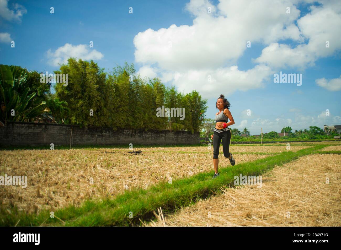 healthy lifestyle portrait of young happy and fit Southeast Asian Thai ...