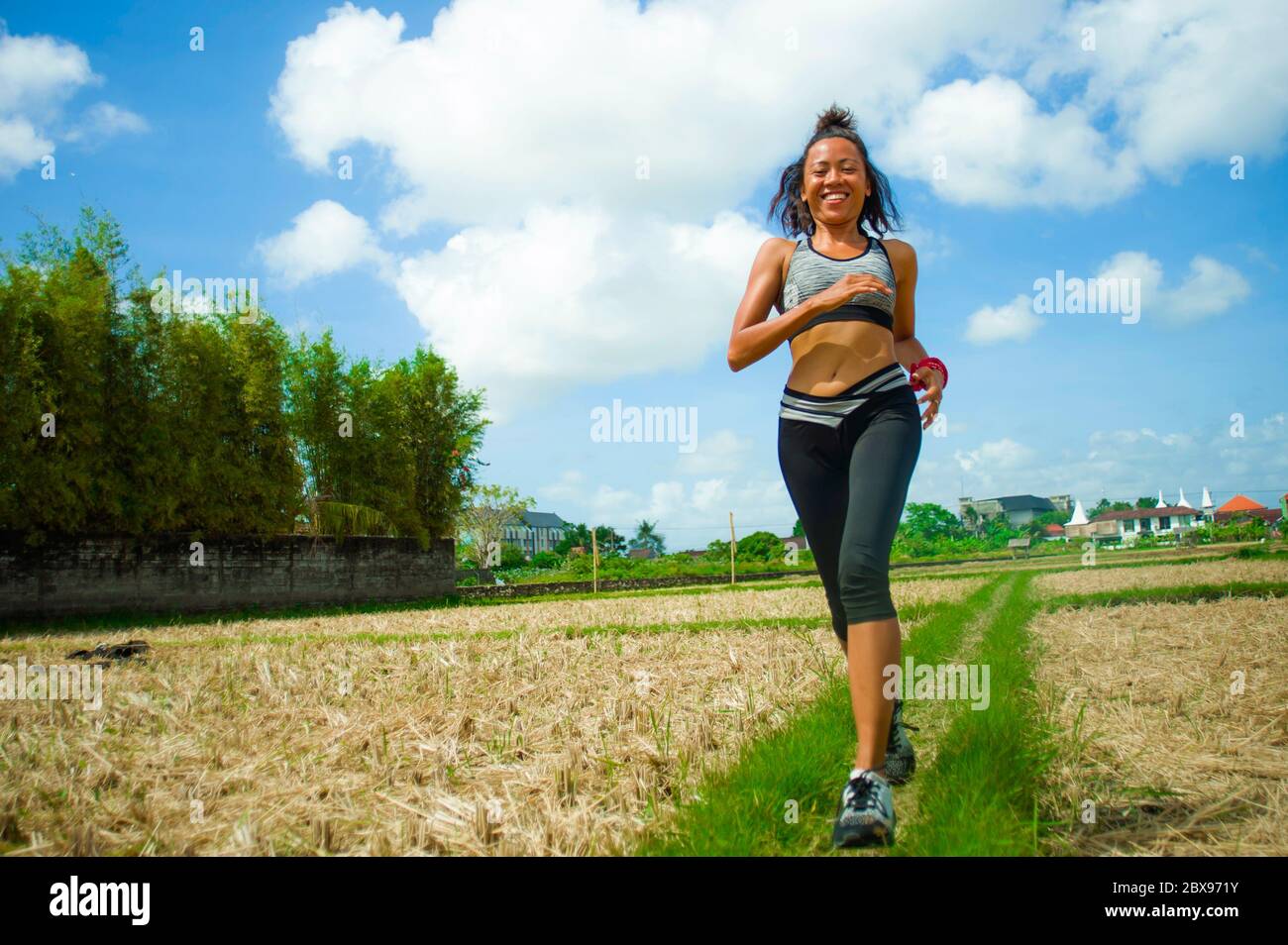 healthy lifestyle portrait of young happy and fit Southeast Asian Thai ...