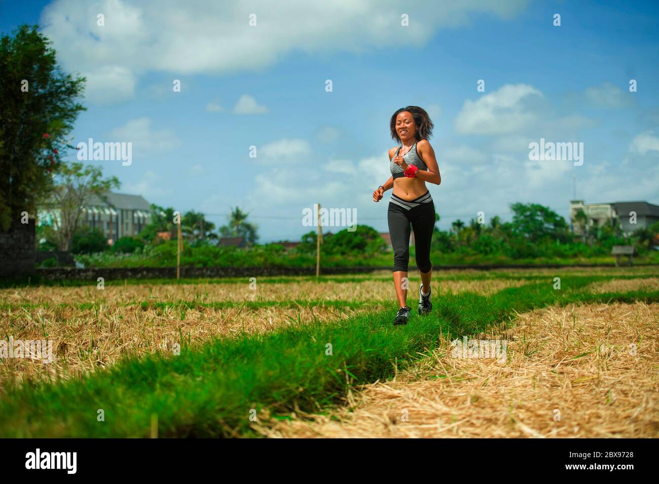 healthy lifestyle portrait of young happy and fit Southeast Asian Thai ...