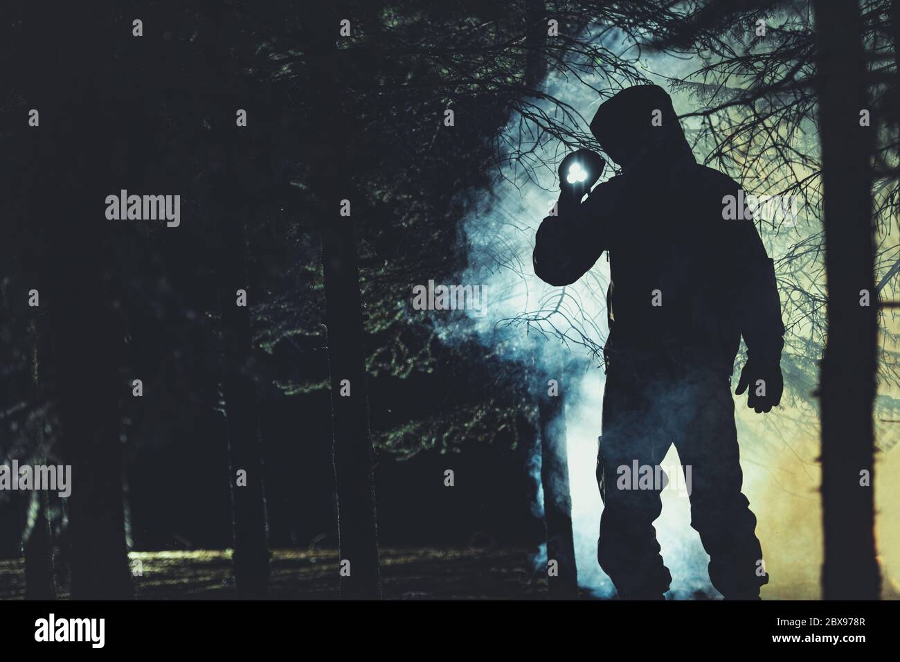 Mysterious Men with Flashlight in His Hand In Dark Foggy Forest ...