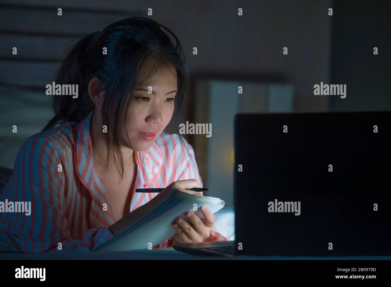 young beautiful and confident Asian Chinese student girl researching ...