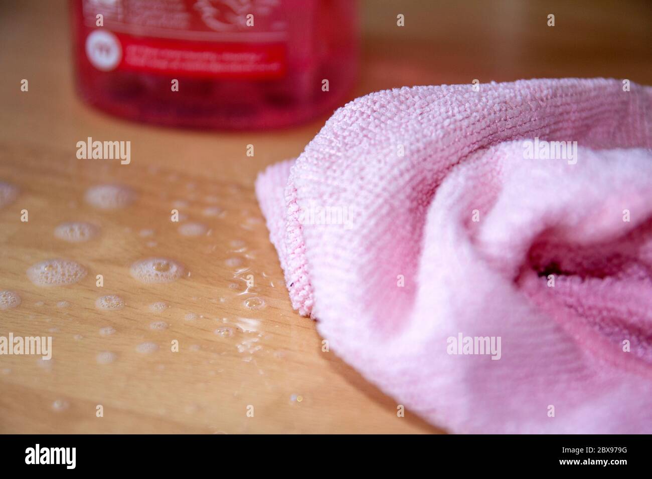 Anti-Bacterial Spray with Cleaning Cloth cleaning a kitchen counter top ...