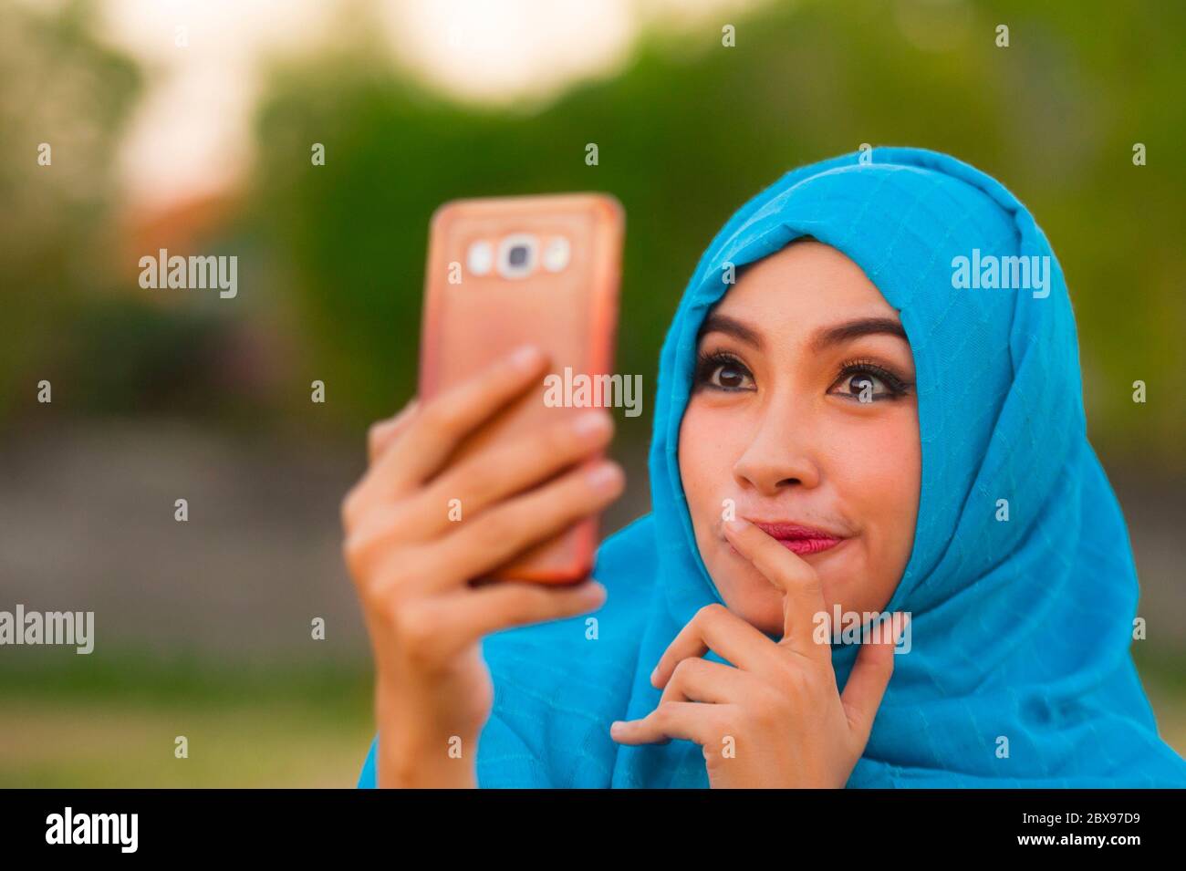 Lifestyle Portrait Of Young Happy And Beautiful Tourist Woman In Muslim Hijab Head Scarf Taking
