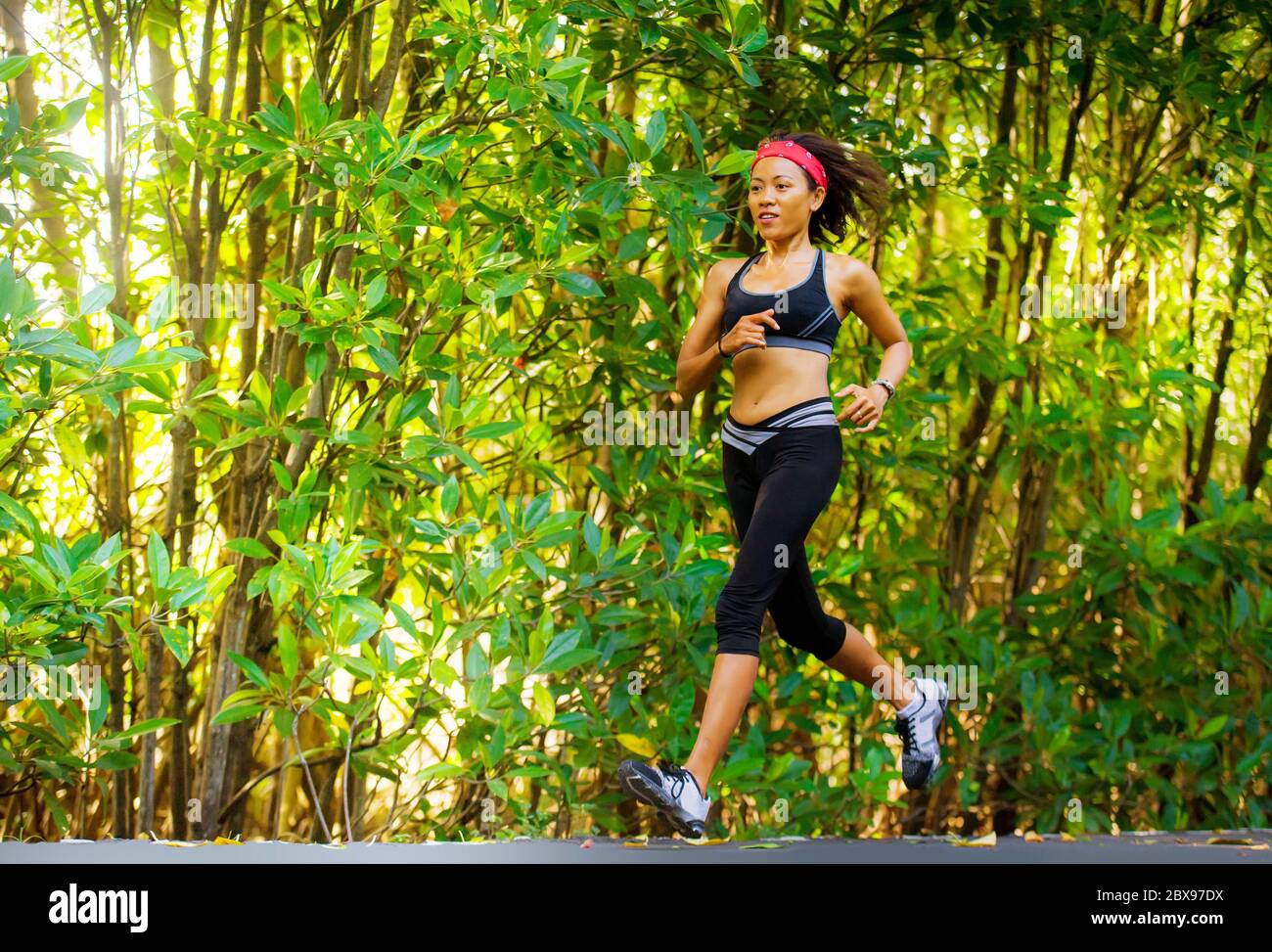 lifestyle outdoors portrait of young fit and happy Asian Chinese woman ...