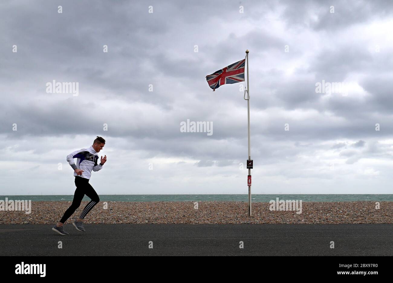 A runner battles wind hi-res stock photography and images - Alamy