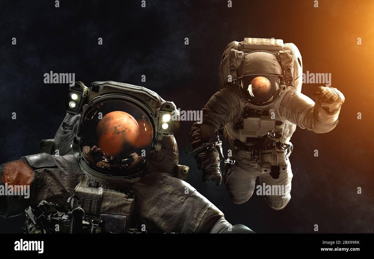 Astronauts in front of Mars. Solar System Stock Photo - Alamy
