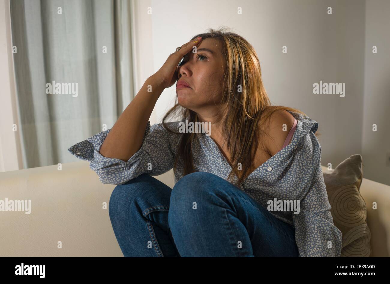 dramatic lifestyle portrait of young beautiful sad and depressed woman ...