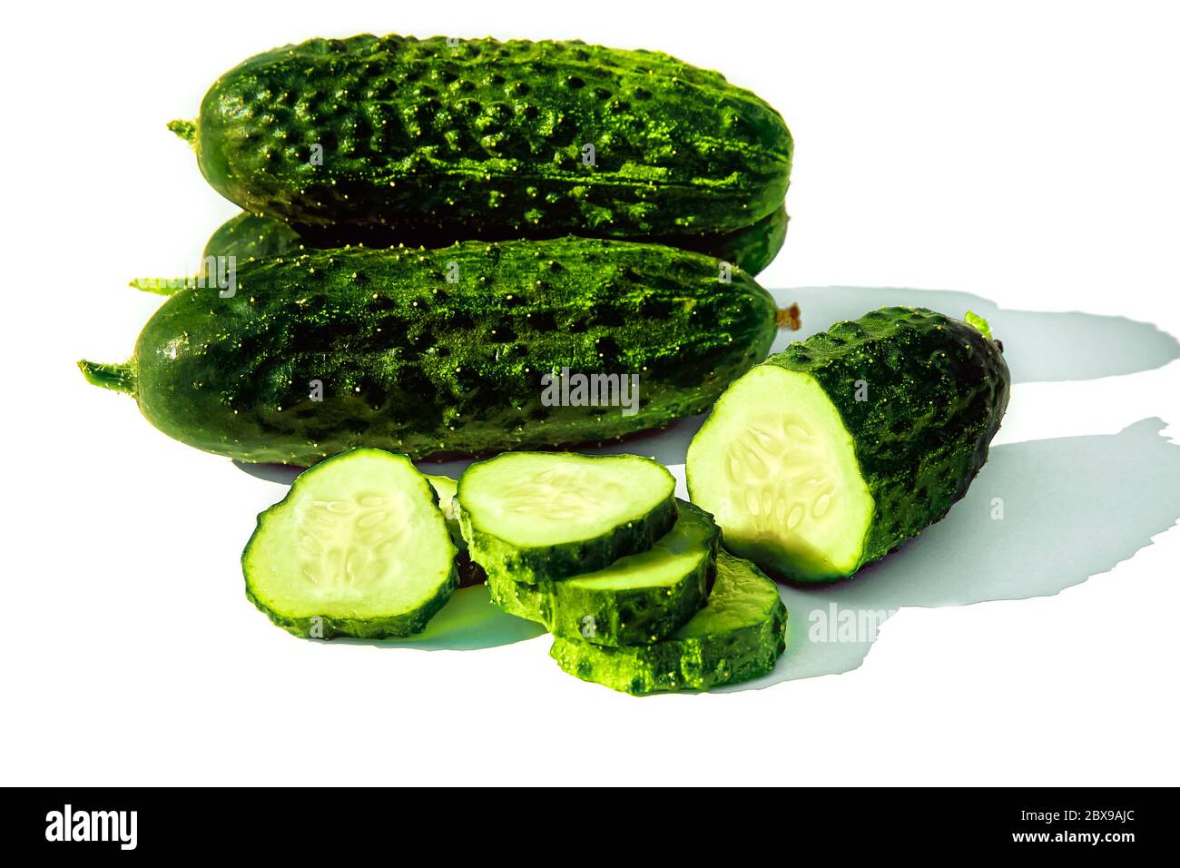 Fresh green cucumber with leaves and flowers of natural vegetables and ...