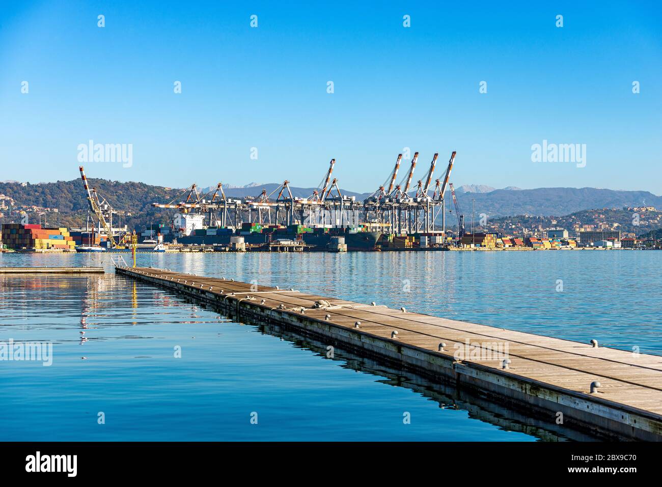 Commercial dock of La Spezia with container ship and cranes. Harbor in ...