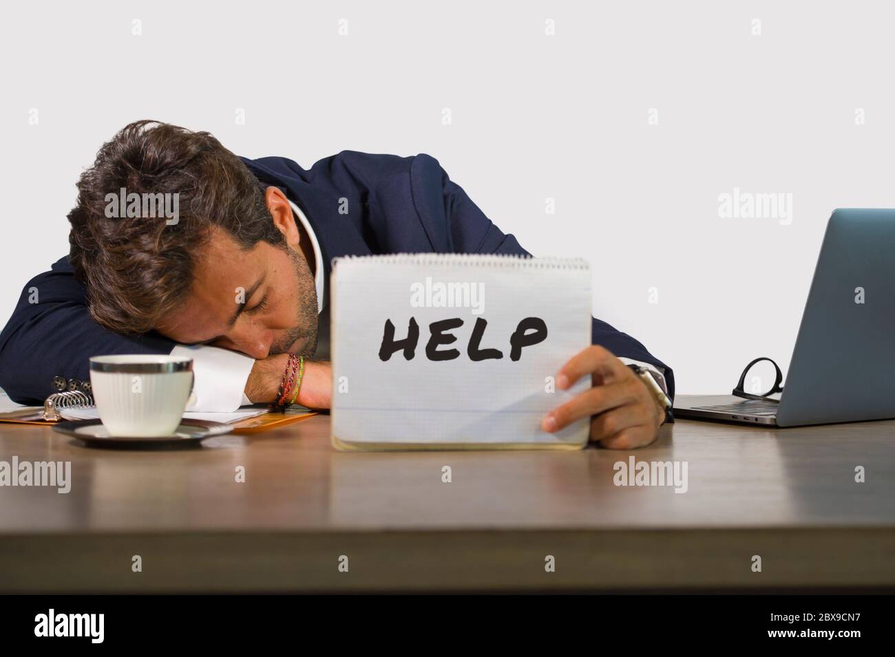 young attractive sad and depressed business man working at office ...