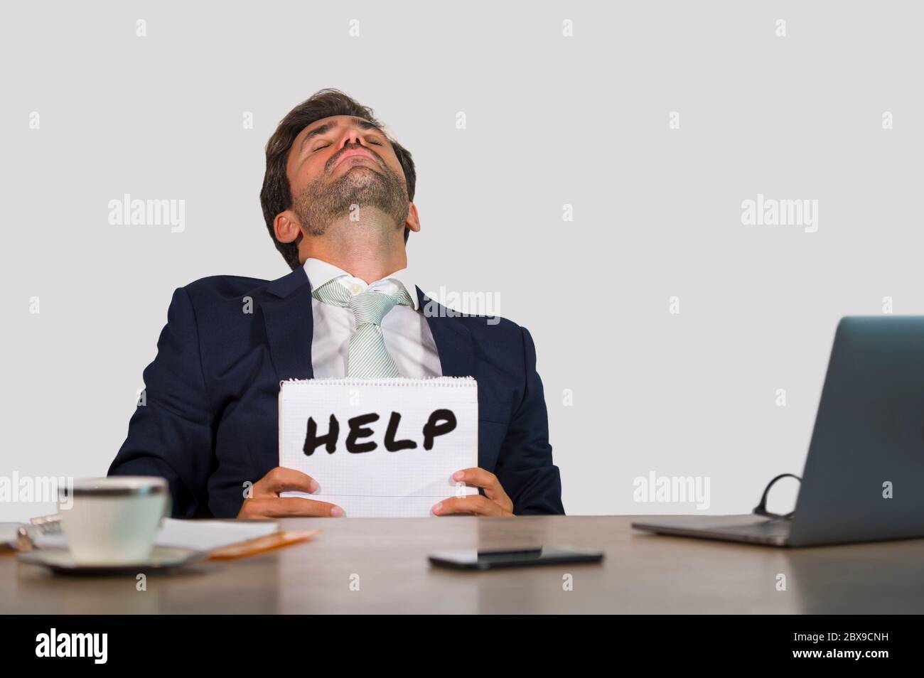 young attractive sad and depressed business man working at office ...