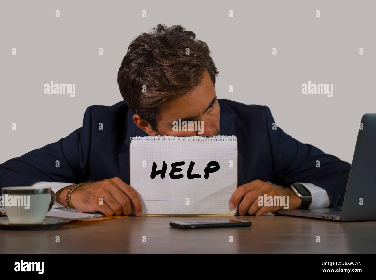 young attractive sad and depressed business man working at office ...