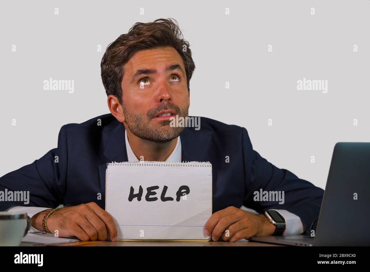 young attractive sad and depressed business man working at office ...