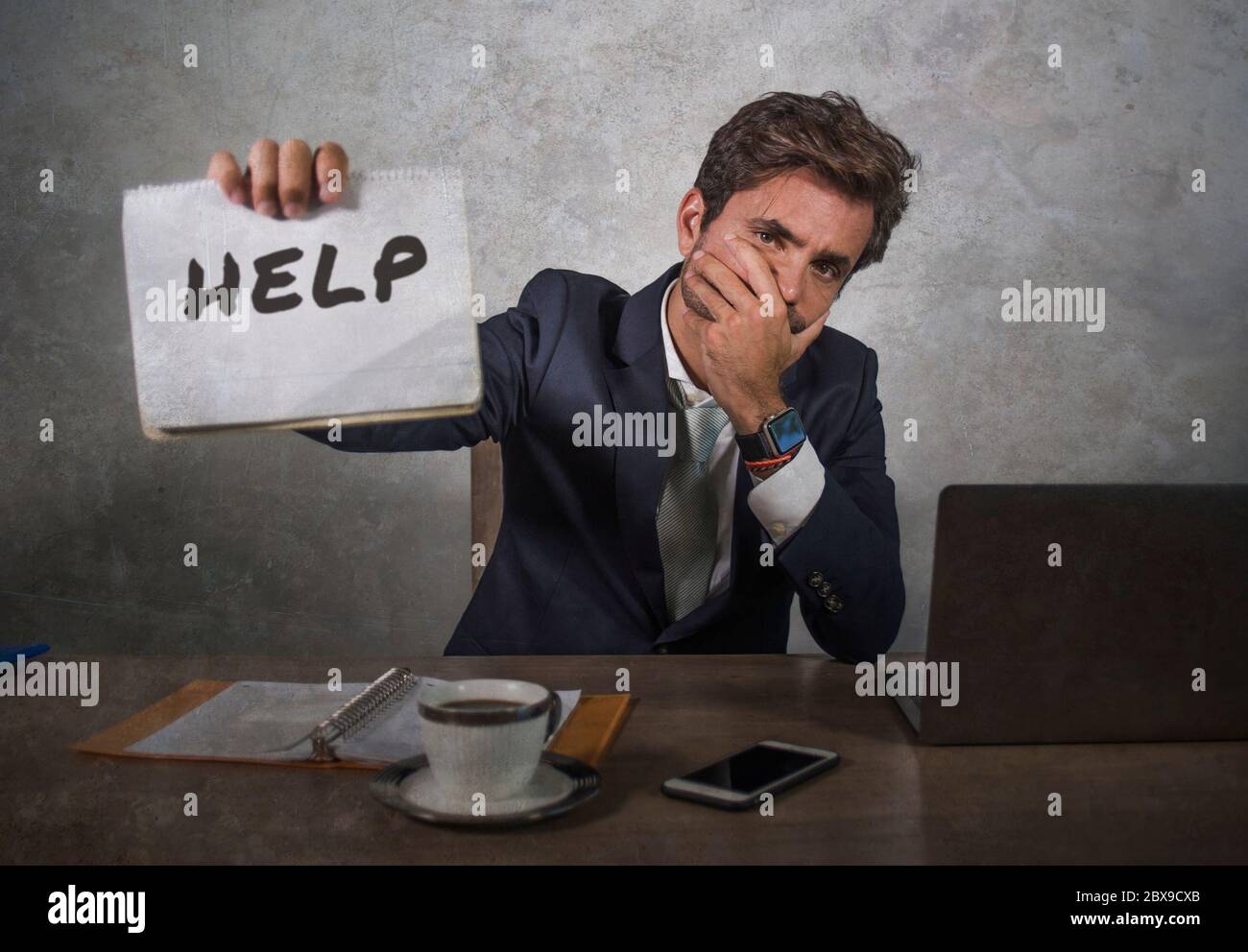 young attractive sad and depressed business man working at office ...