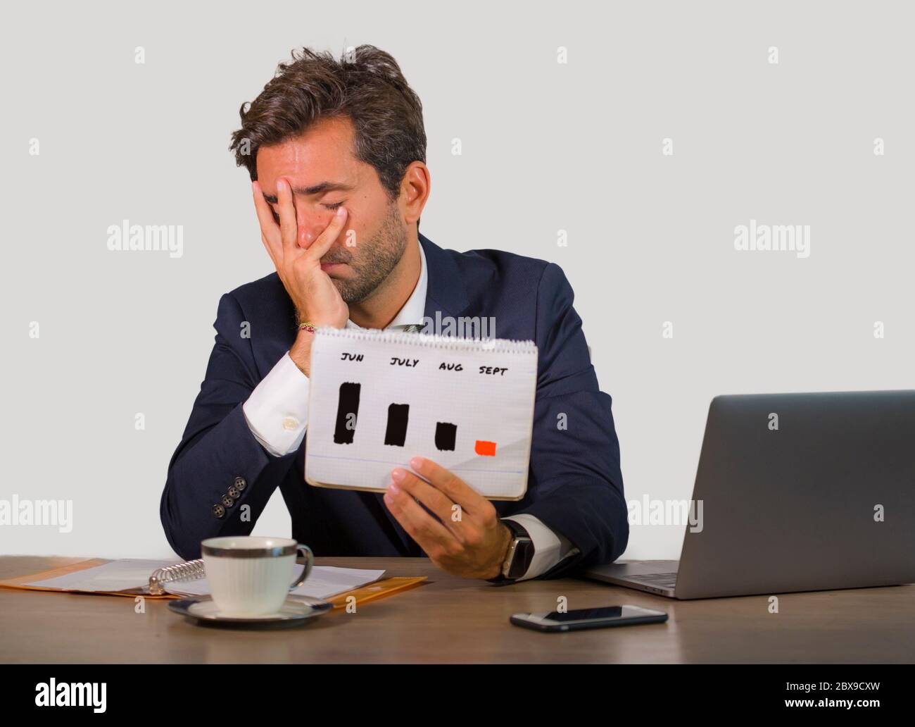 young attractive sad and depressed businessman working in stress at ...