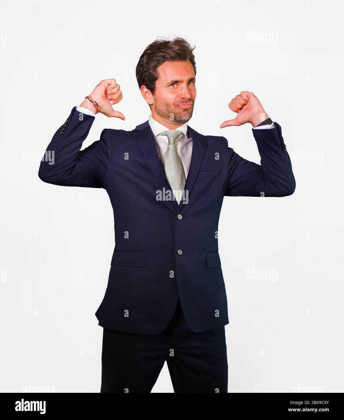 young elegant and handsome businessman in suit and tie posing for ...