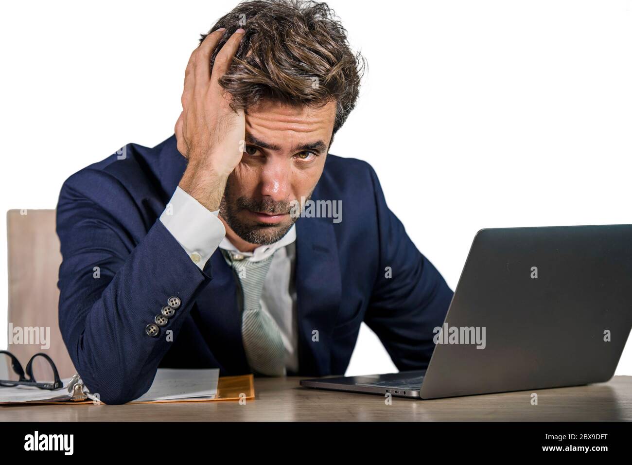 young sad and depressed business man working overwhelmed and frustrated ...